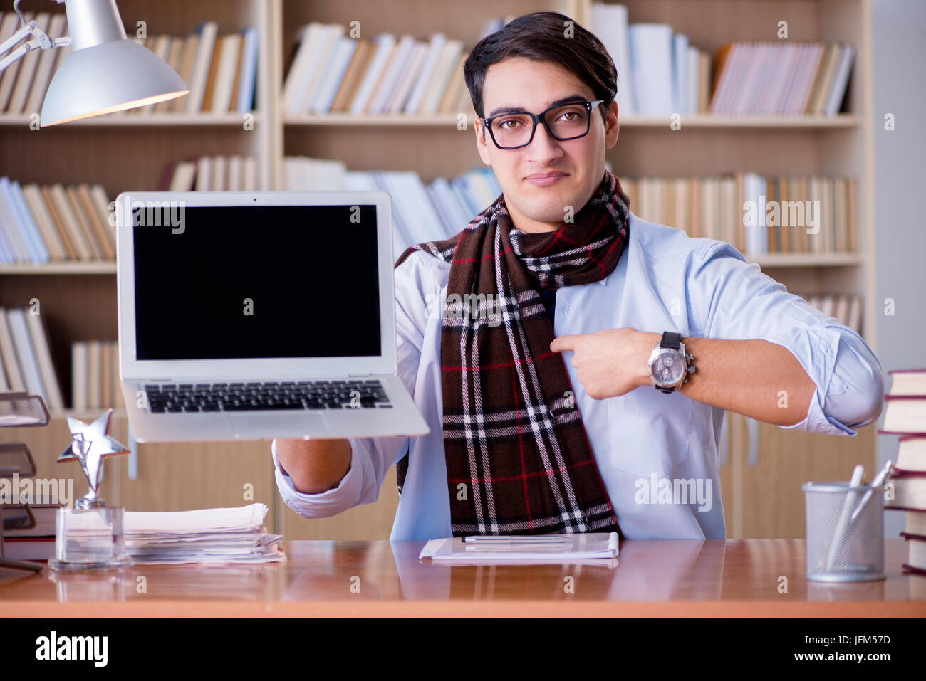 Young writer working in the library Stock Photo - Alamy