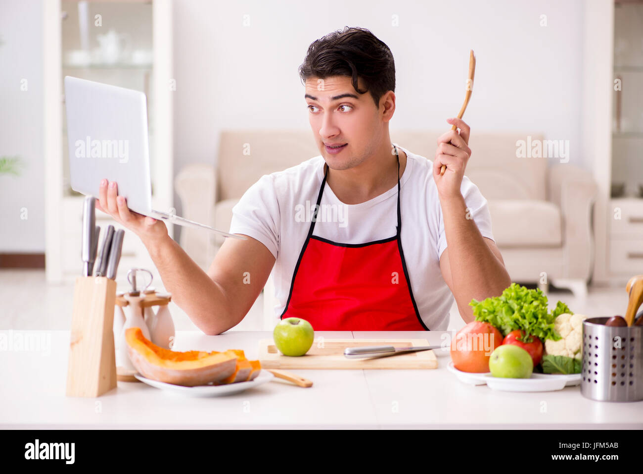 Funny man cook working in the kitchen Stock Photo - Alamy