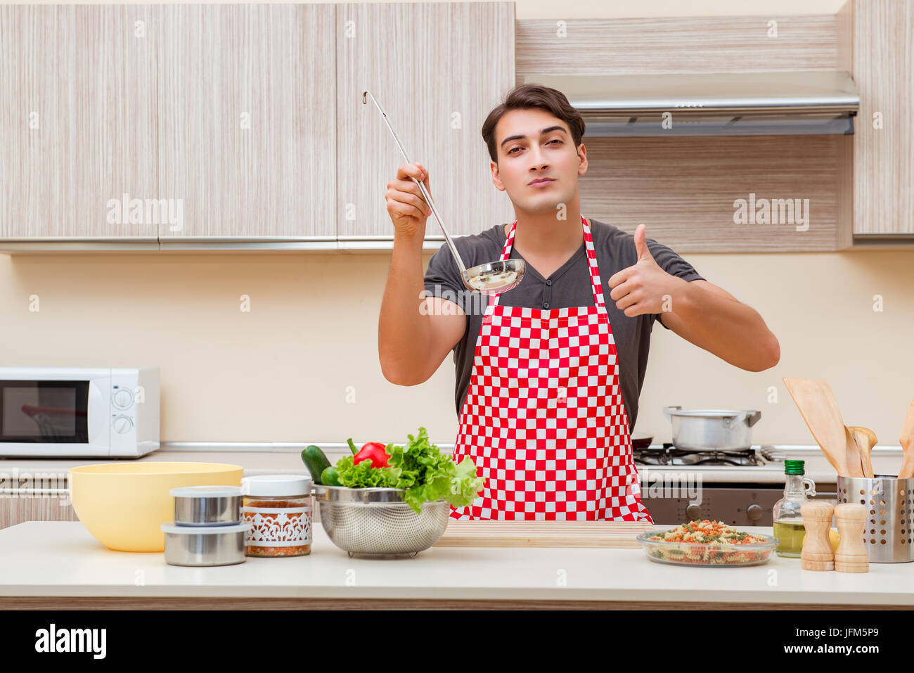 Man male cook preparing food in kitchen Stock Photo - Alamy