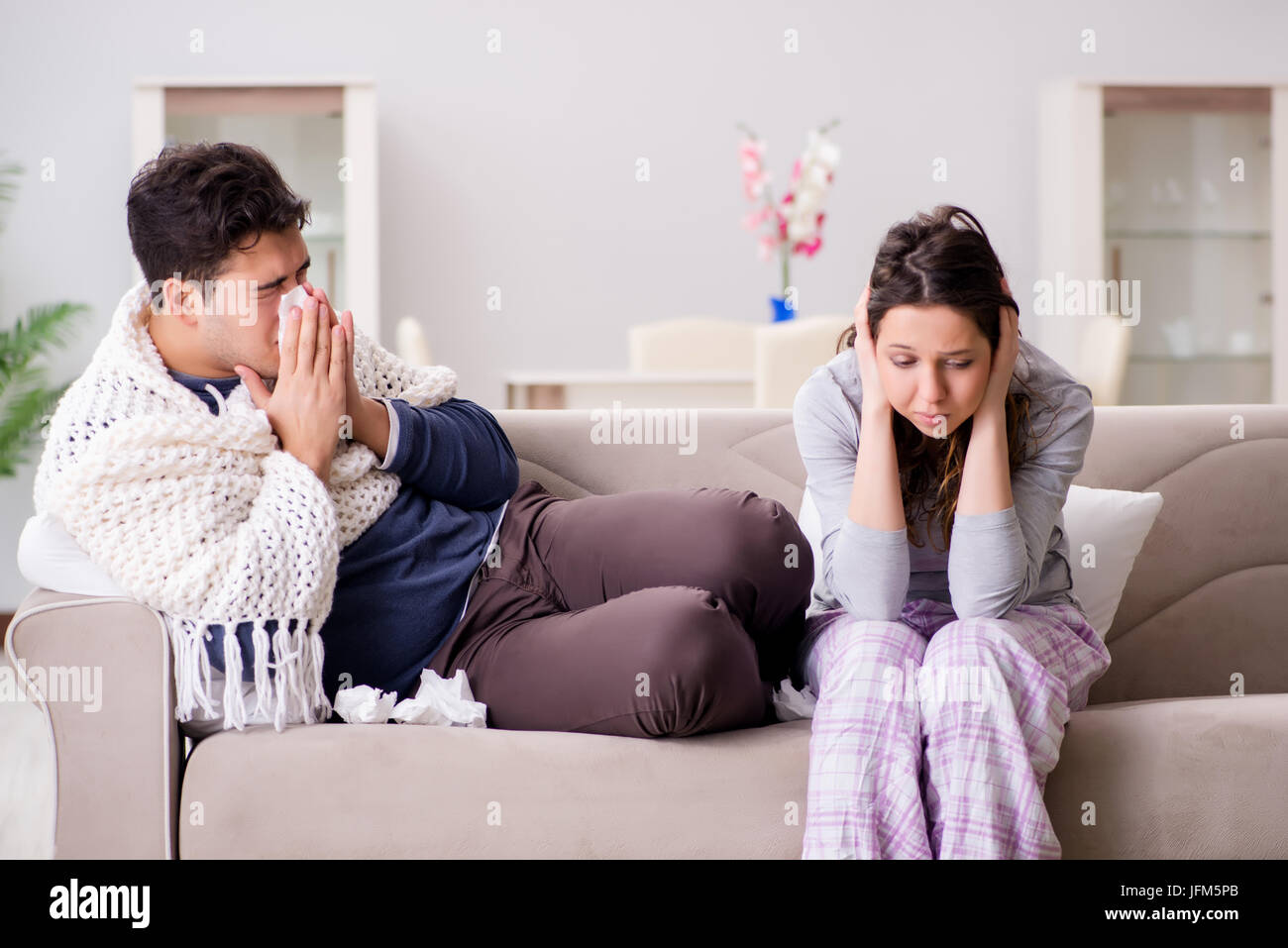 Wife caring for sick husband at home Stock Photo - Alamy