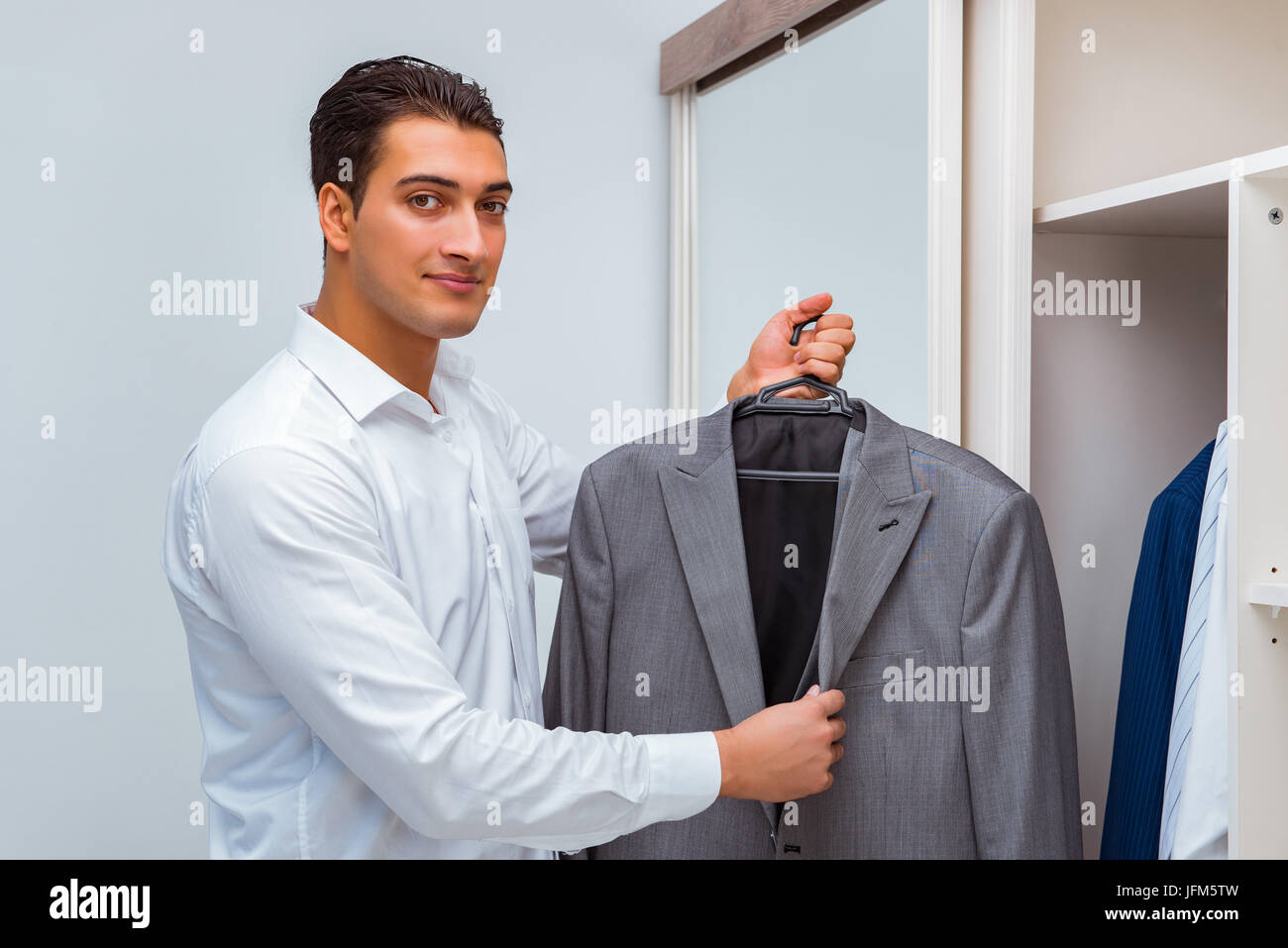 Businessman dressing up for work Stock Photo - Alamy