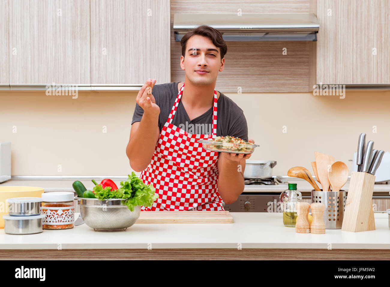 Man male cook preparing food in kitchen Stock Photo - Alamy