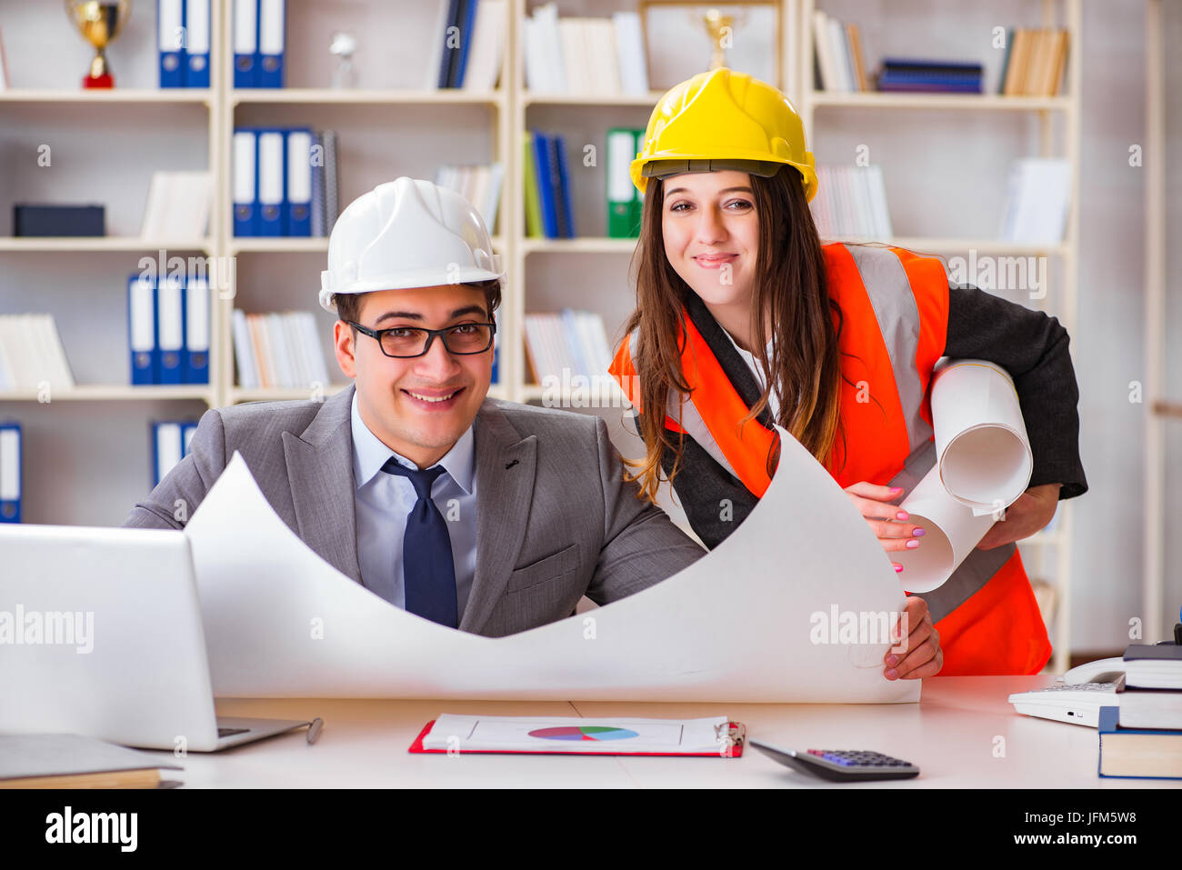 Reviewing architectural drawings hi-res stock photography and images ...