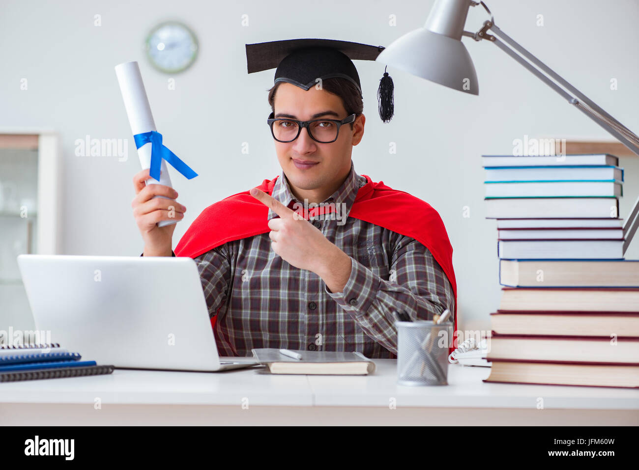 Super hero student with books studying for exams Stock Photo - Alamy