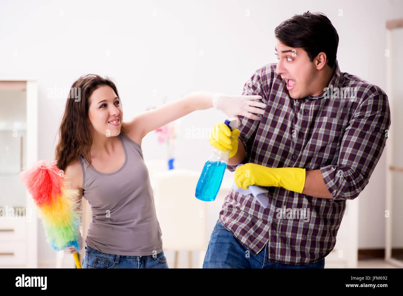 Wife and husband doing cleaning at home Stock Photo - Alamy