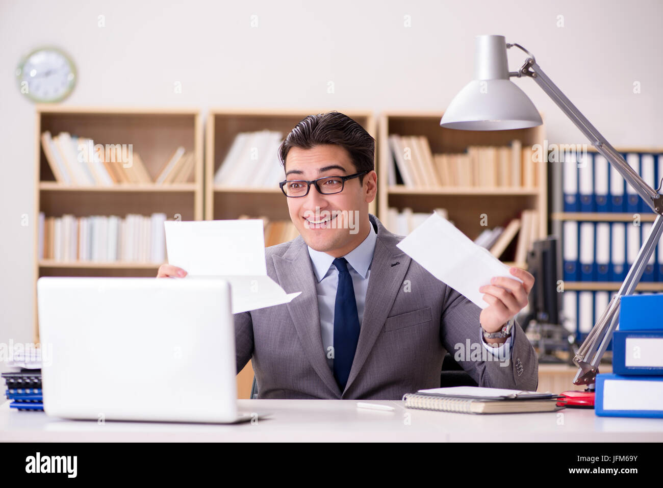 Businessman receiving letter in the office Stock Photo - Alamy