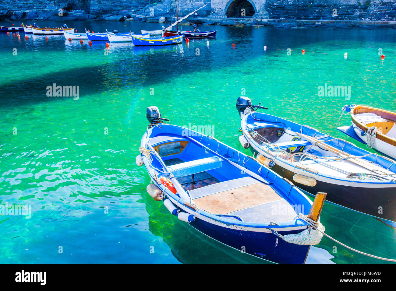 Beautiful cozy bay with boats and clear turquoise water in Italy ...