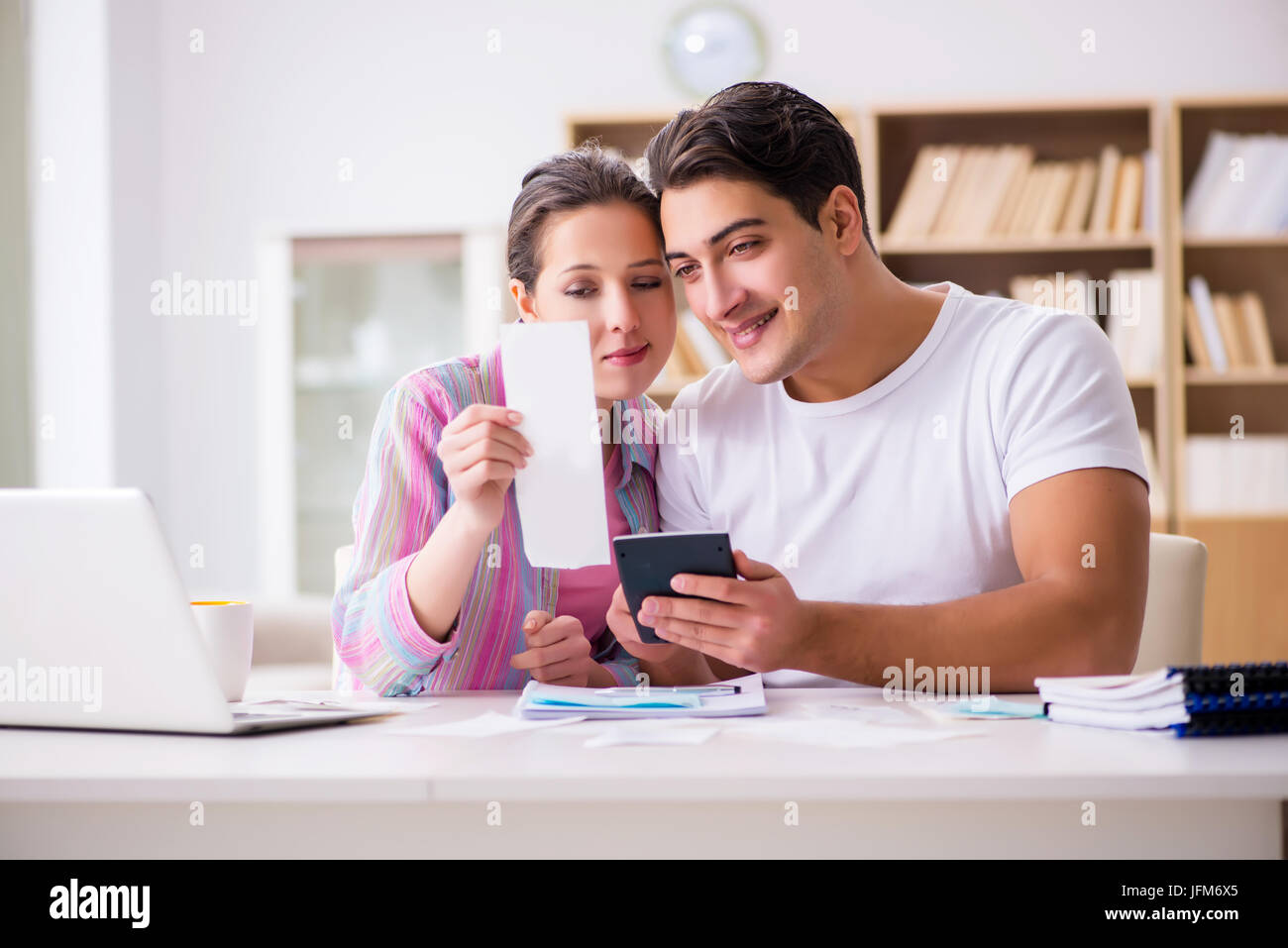 Young family discussing family finances Stock Photo - Alamy