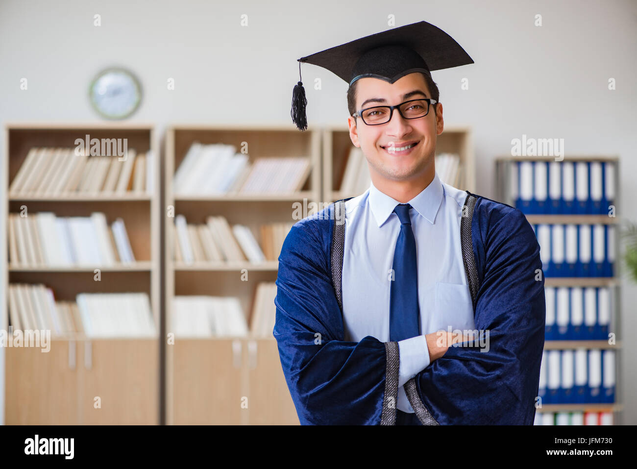 Young man graduating from university Stock Photo - Alamy