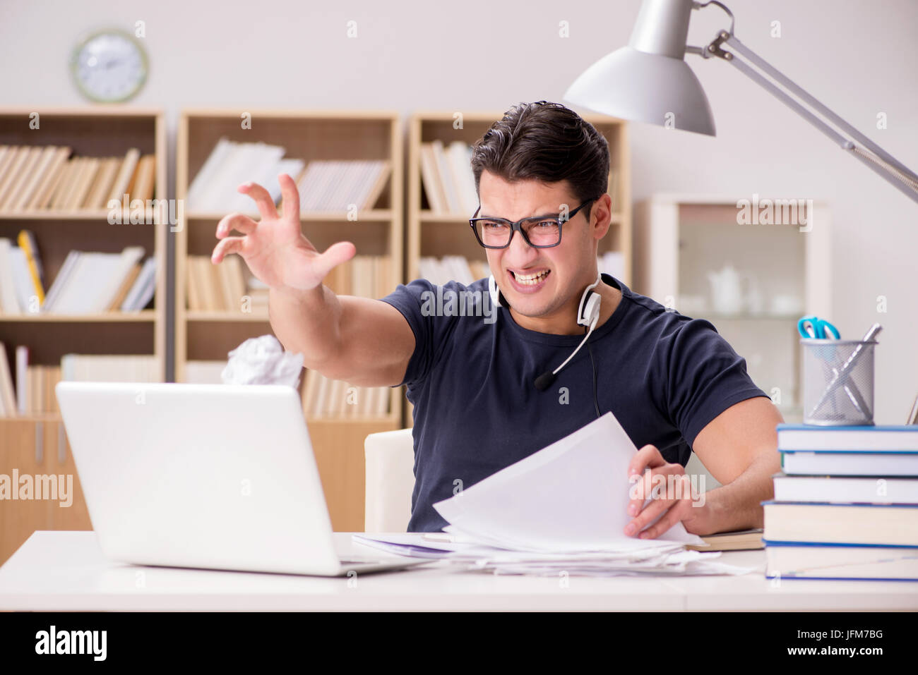 Angry man tearing apart his paperwork due to stress Stock Photo - Alamy
