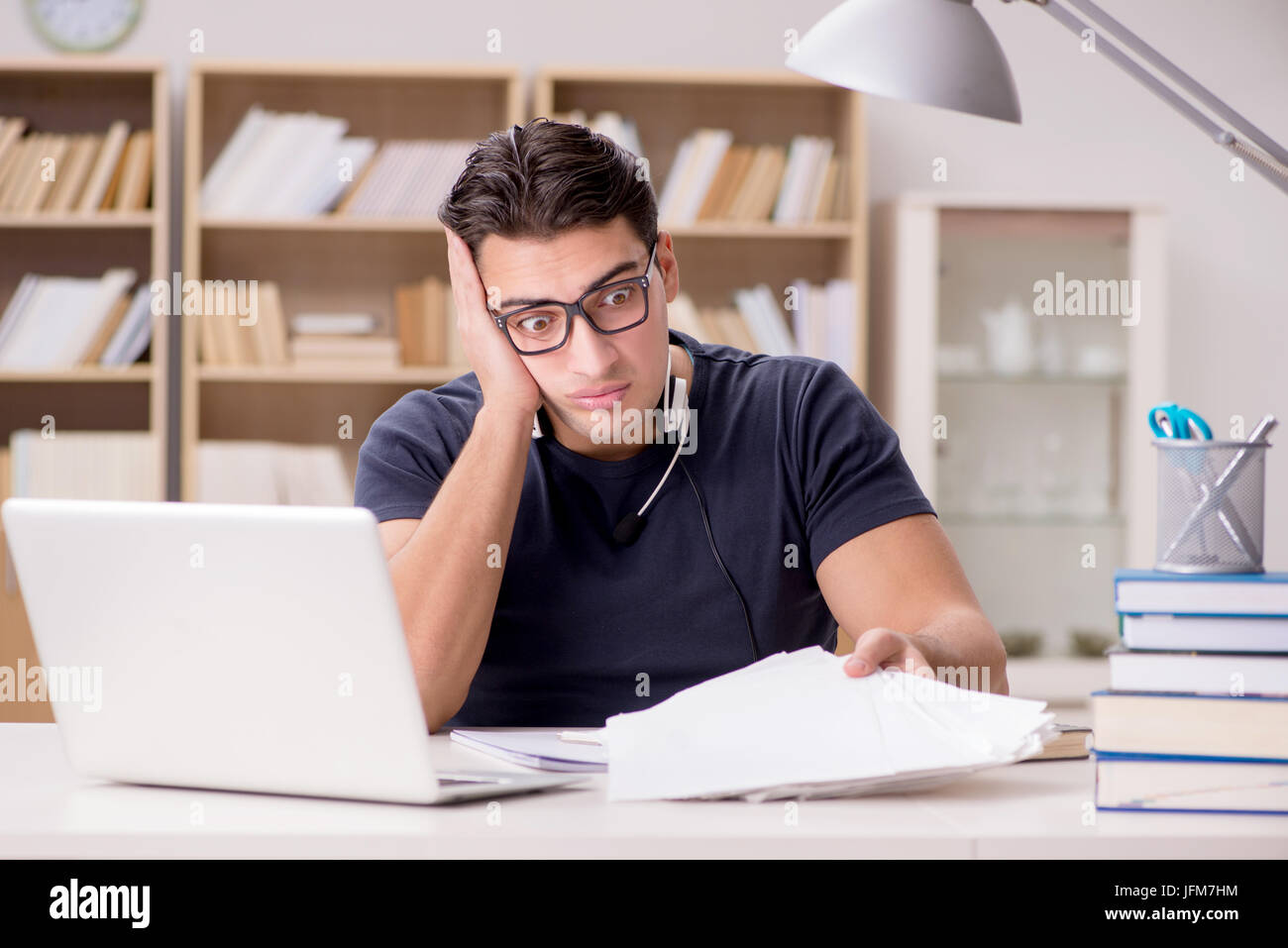 Angry man with too much paperwork to do Stock Photo - Alamy