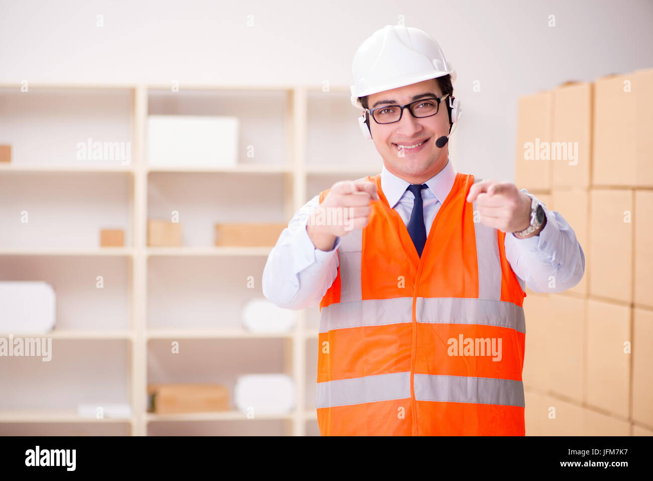 Man working in postal parcel delivery service office Stock Photo - Alamy