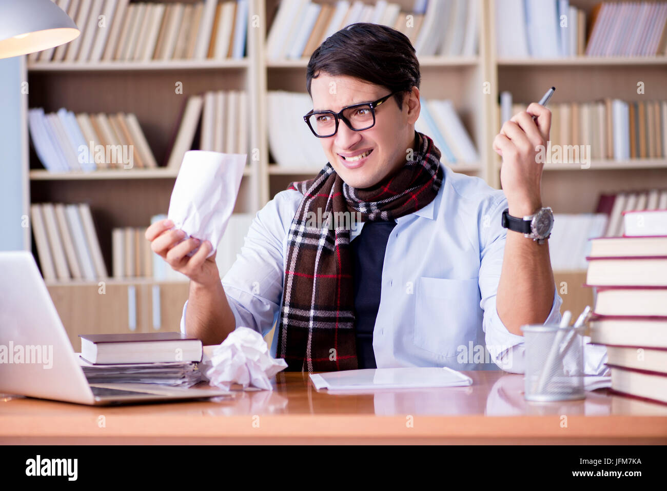 Young writer working in the library Stock Photo - Alamy