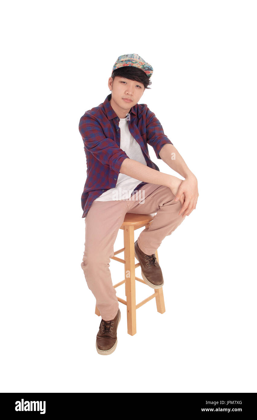 Asian man sitting and relaxing Stock Photo - Alamy