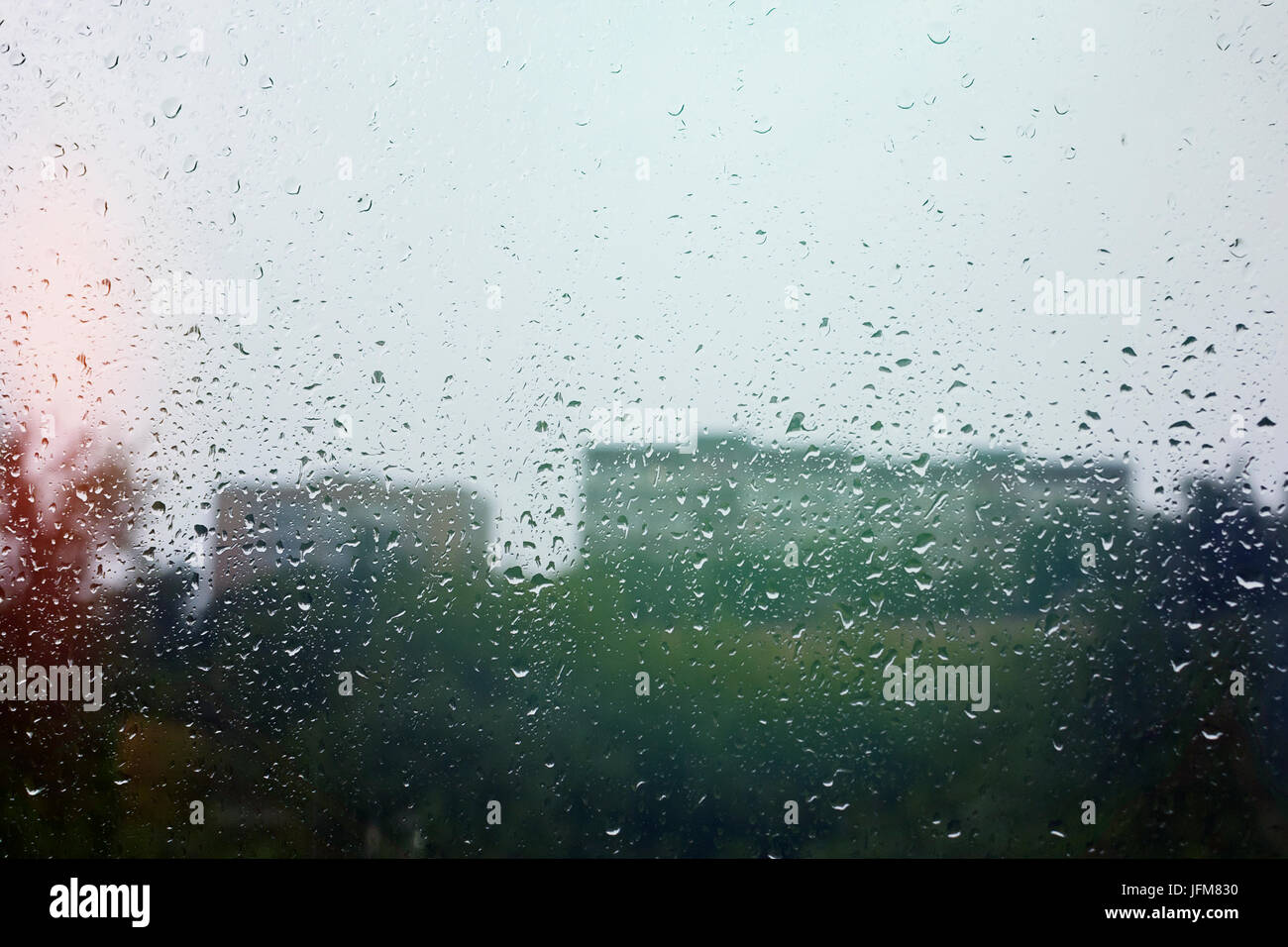 Wet window with drops, blur background Stock Photo - Alamy