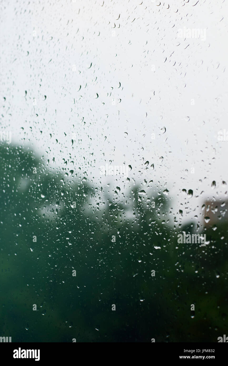 Wet window with drops, blur background Stock Photo - Alamy