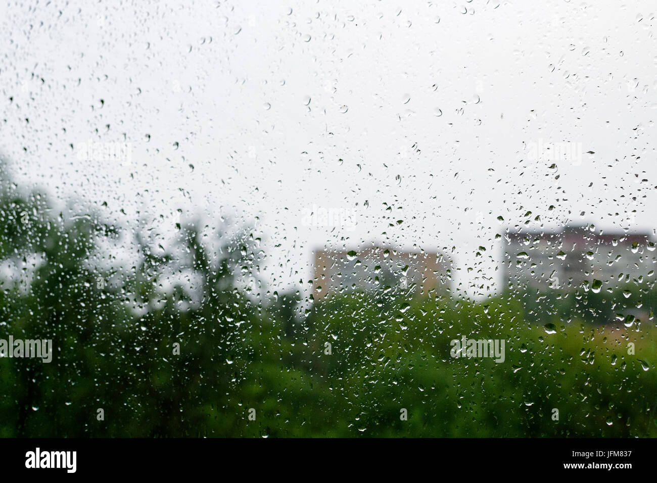Wet window with drops, blur background Stock Photo - Alamy