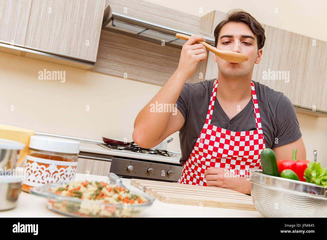 Man male cook preparing food in kitchen Stock Photo - Alamy