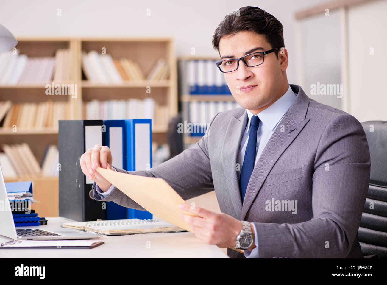 Businessman receiving letter in the office Stock Photo - Alamy