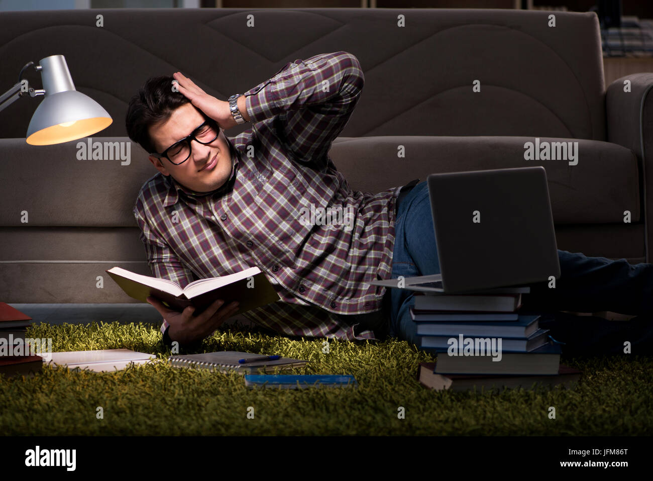 Student reading books preparing for exams Stock Photo - Alamy