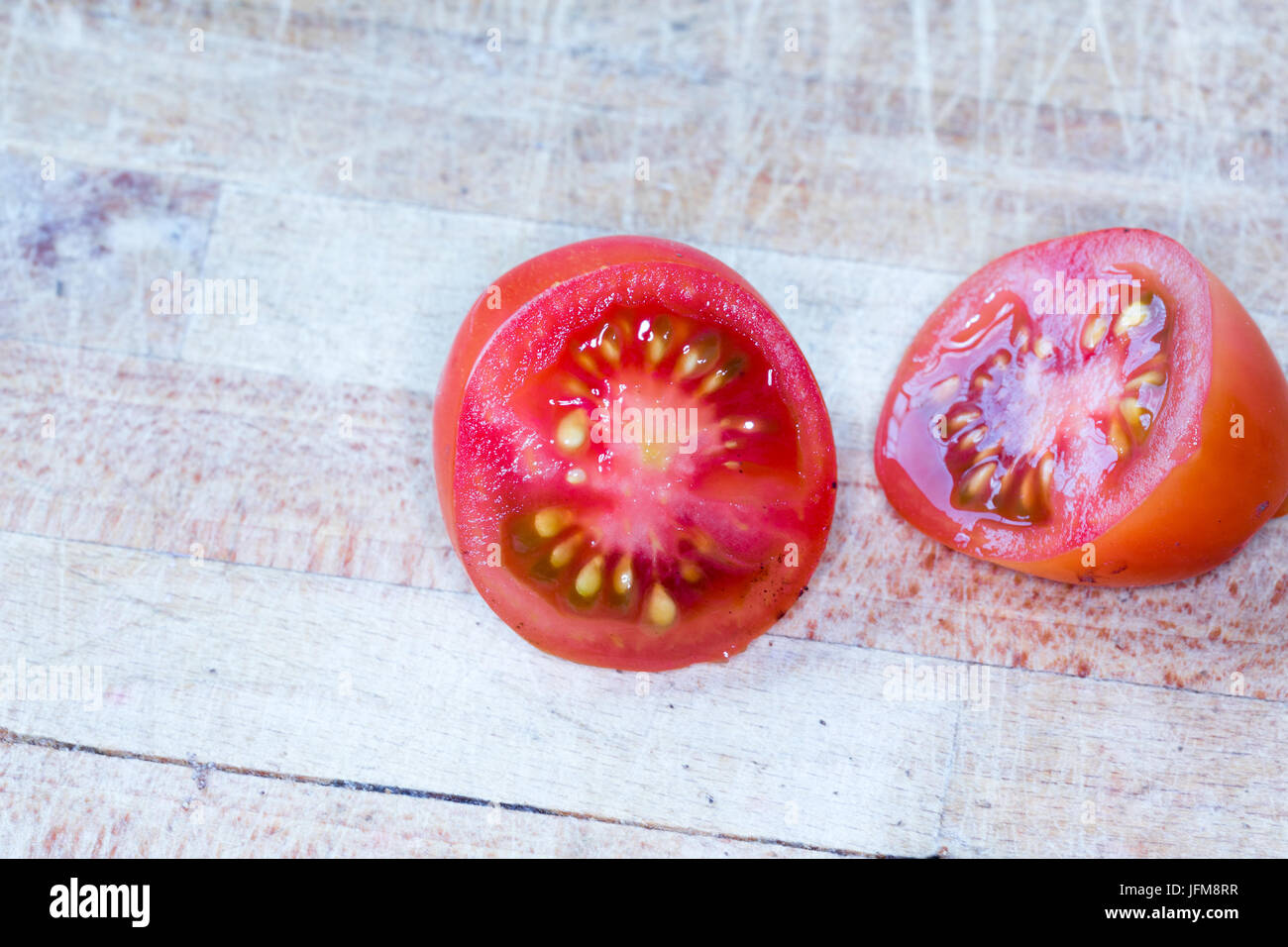 Tomato cut isolated Stock Photo - Alamy