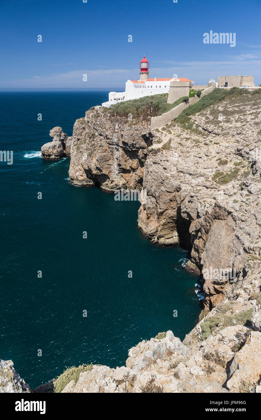 The cliffs and lighthouse overlooks the blue Atlantic ocean at Cabo De ...