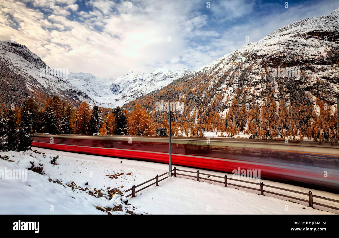 Bernina Express making its journey through the Swiss Alps, Engadine ...