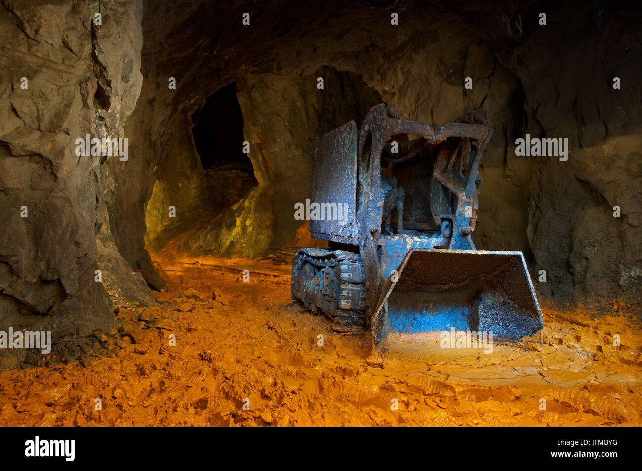 Old abandoned mine in Tuscany, an old scraper in the orange mud, Buca ...