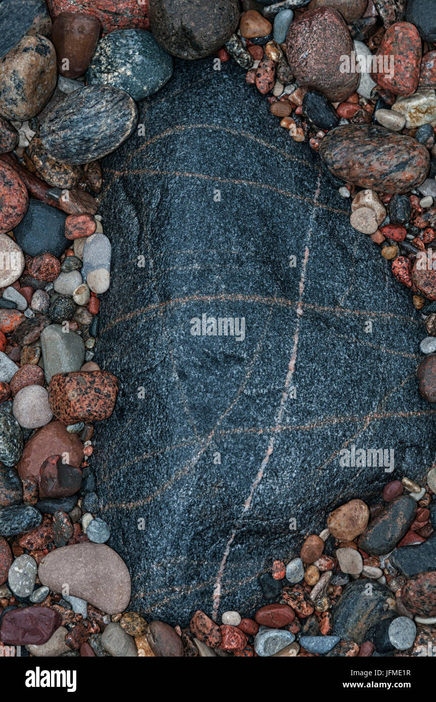 Natural Science, Wet stones on the seashore Stock Photo - Alamy