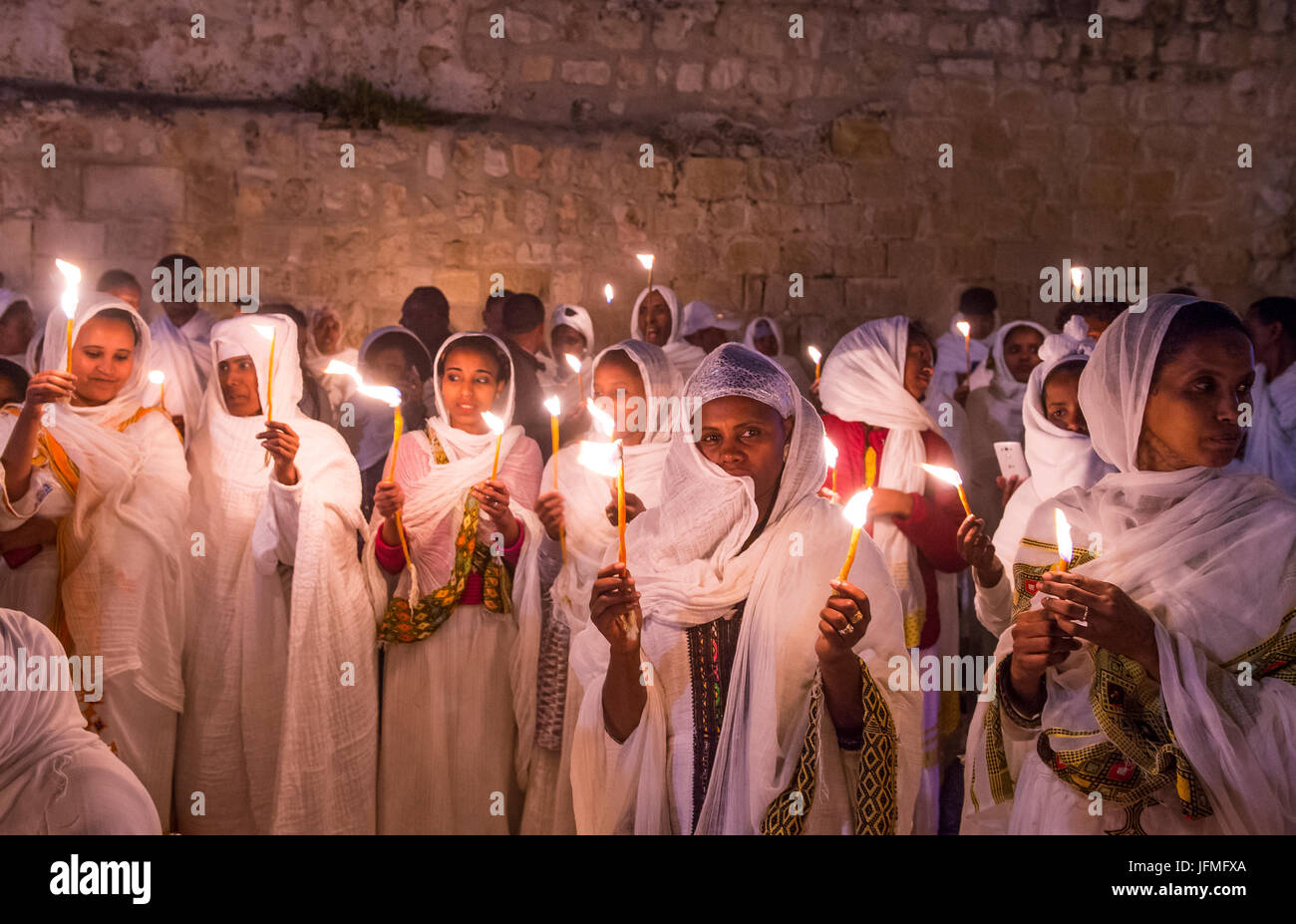 Ethiopian Orthodox pilgrims participates in the Holy fire ceremony at ...