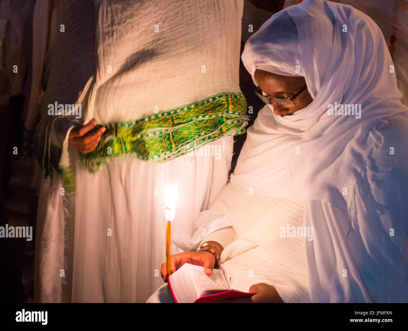 Ethiopian Orthodox pilgrim participates in the Holy fire ceremony at ...