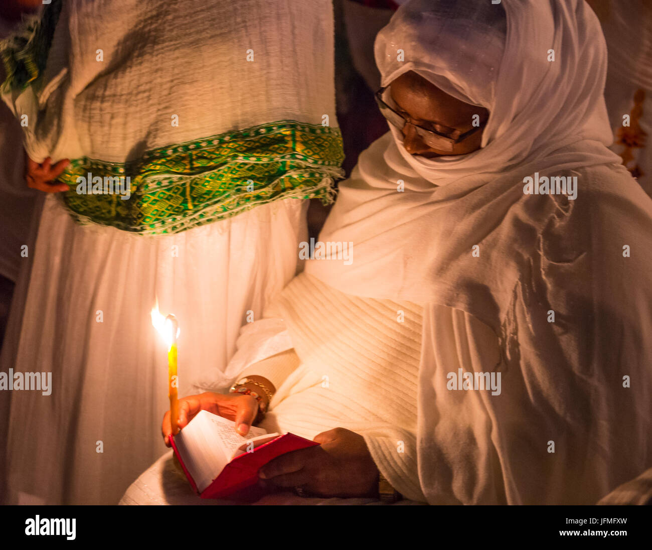 Ethiopian Orthodox pilgrim participates in the Holy fire ceremony at ...
