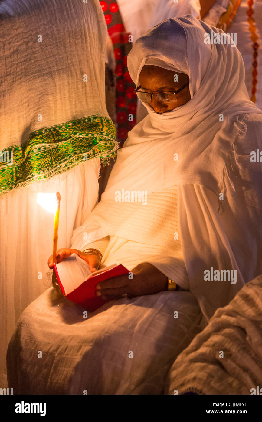 Ethiopian Orthodox pilgrim participates in the Holy fire ceremony at ...