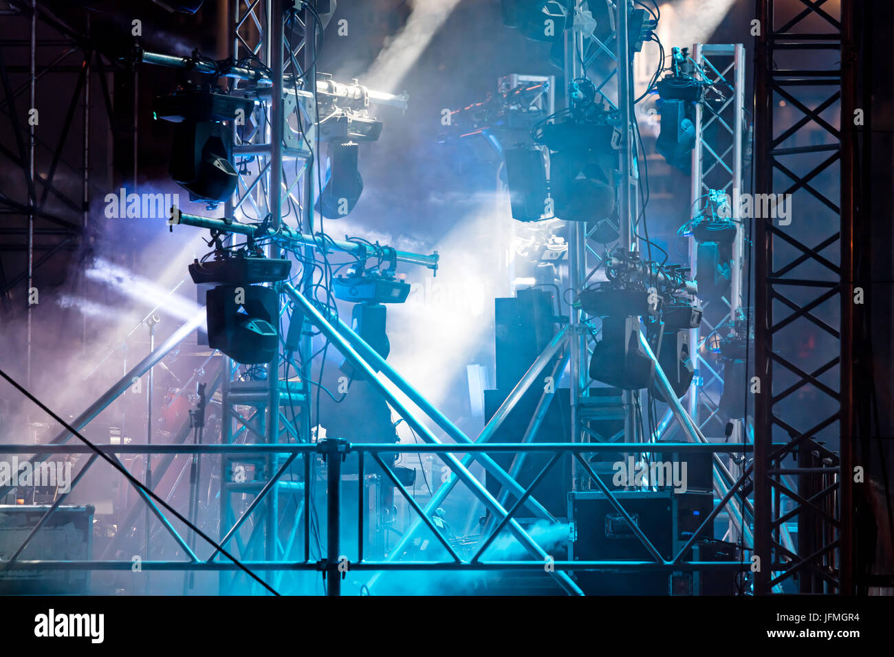 spotlight system illuminating dark stage during the performance ...