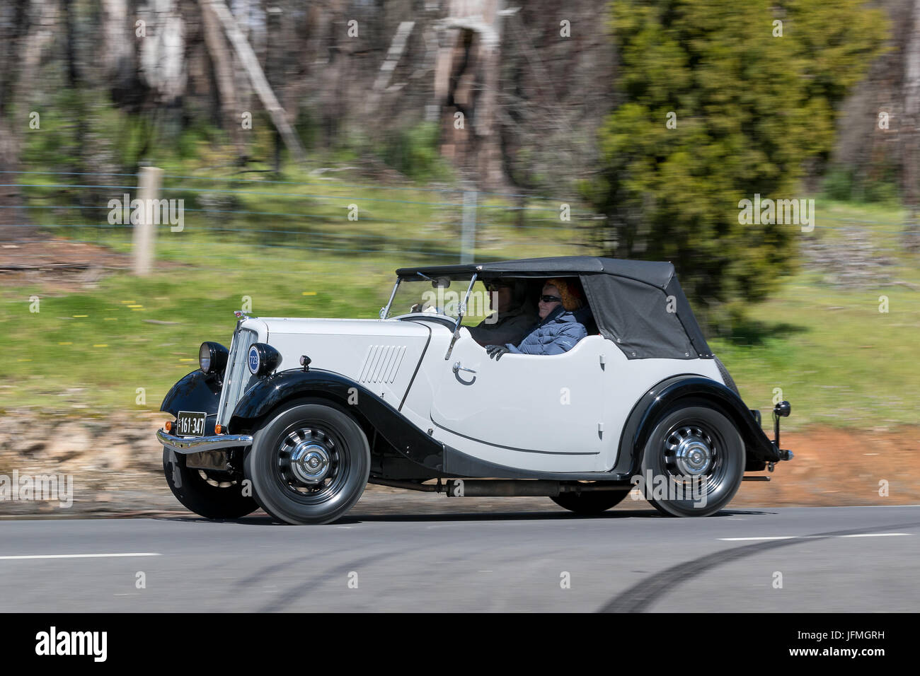 Vintage 1938 Morris 8/40 Roadster driving on country roads near the ...