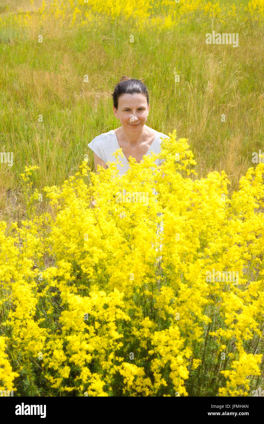 Woman behind bush hi-res stock photography and images - Alamy