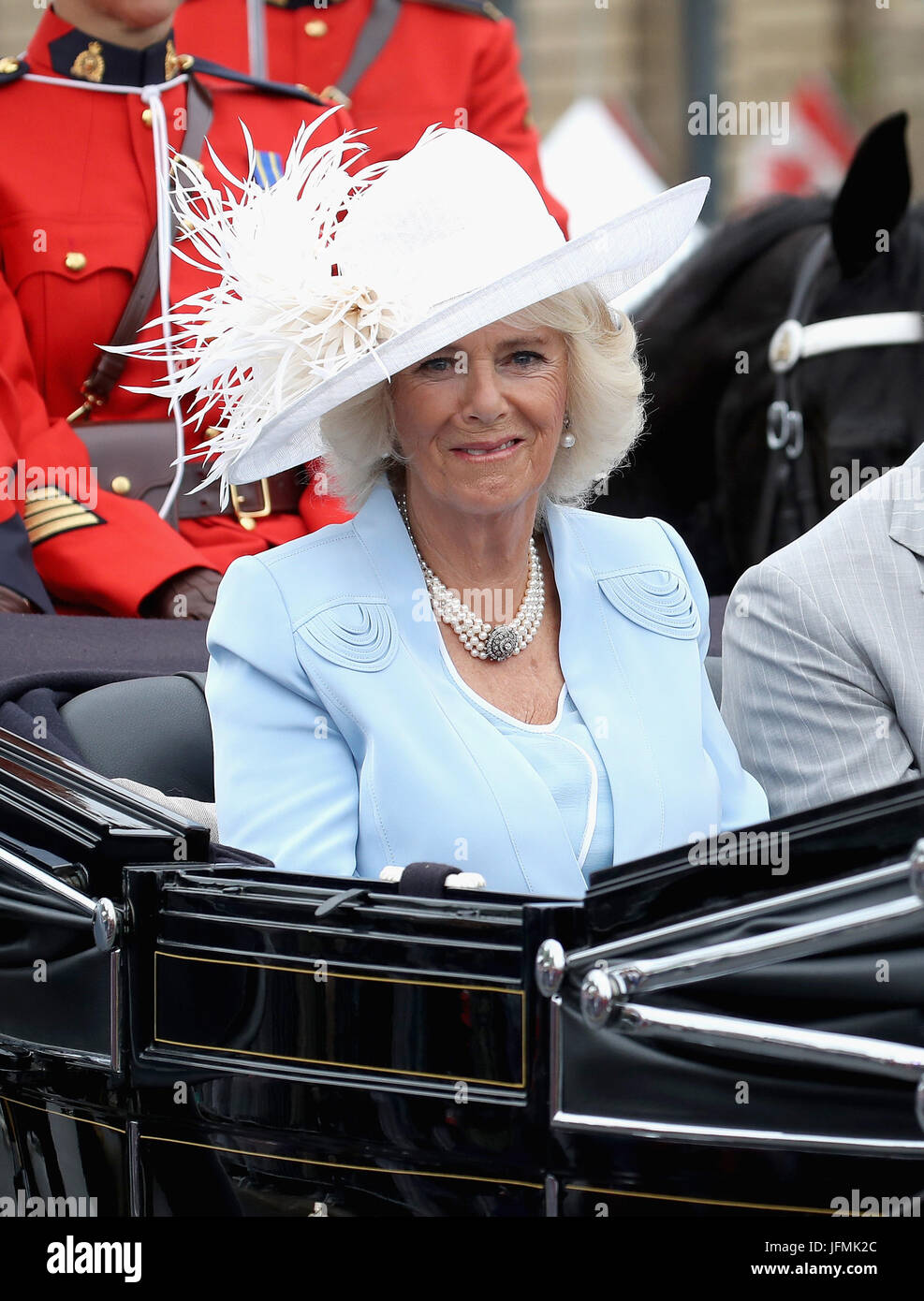 The Prince of Wales and the Duchess of Cornwall, ride in the state ...
