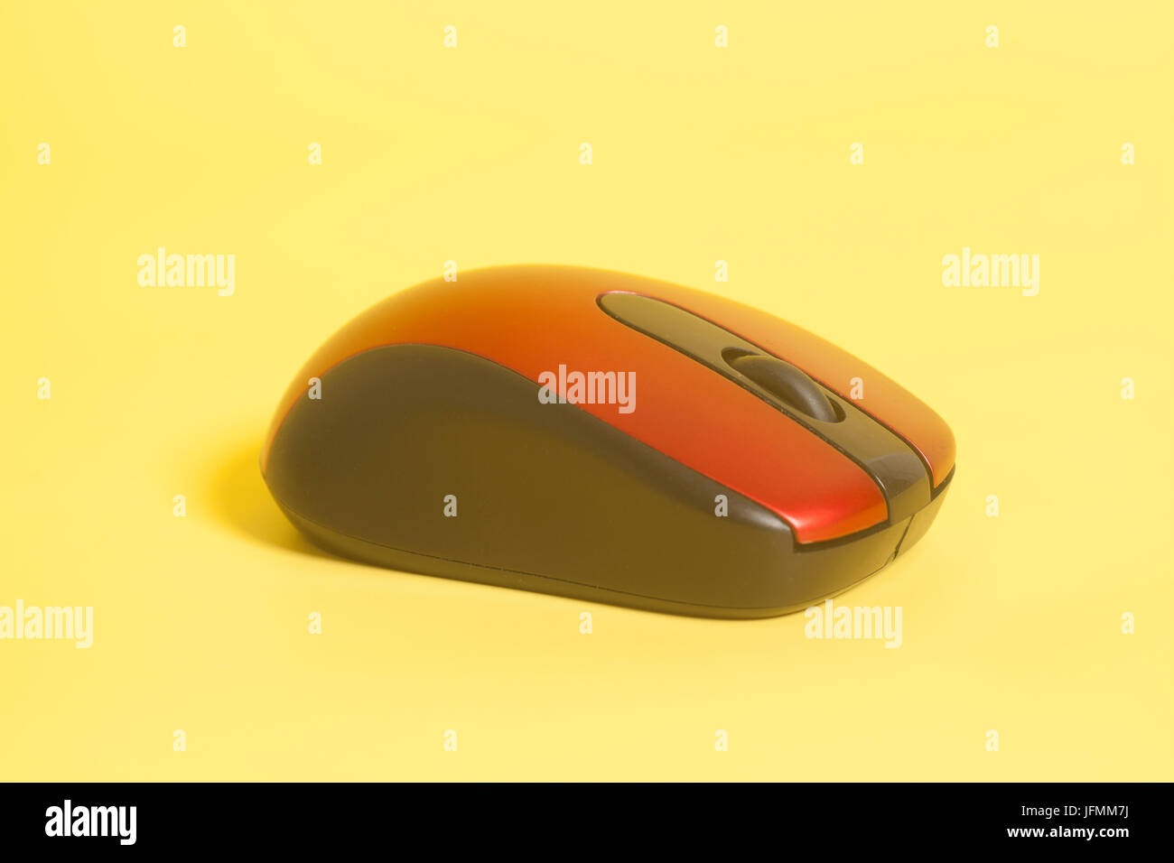 Red computer mouse on yellow background Stock Photo - Alamy