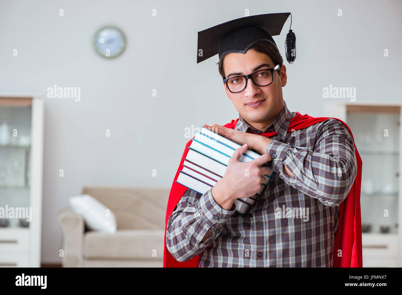 Super hero student with books studying for exams Stock Photo - Alamy