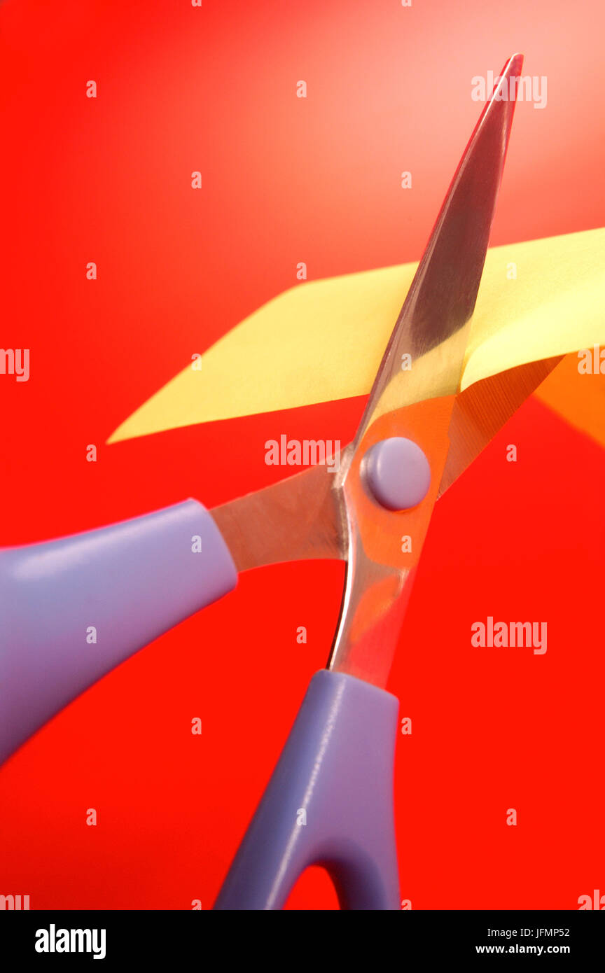 Scissors cutting paper Stock Photo - Alamy