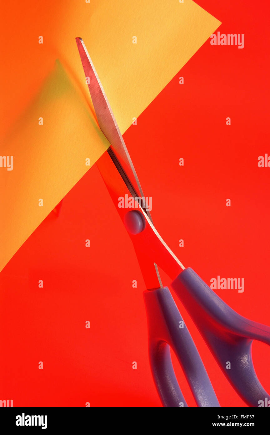 Scissors cutting paper Stock Photo - Alamy