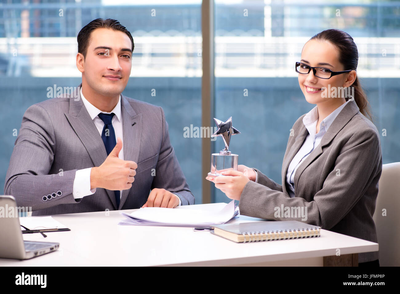 Businesspeople receiving award prize in office Stock Photo - Alamy