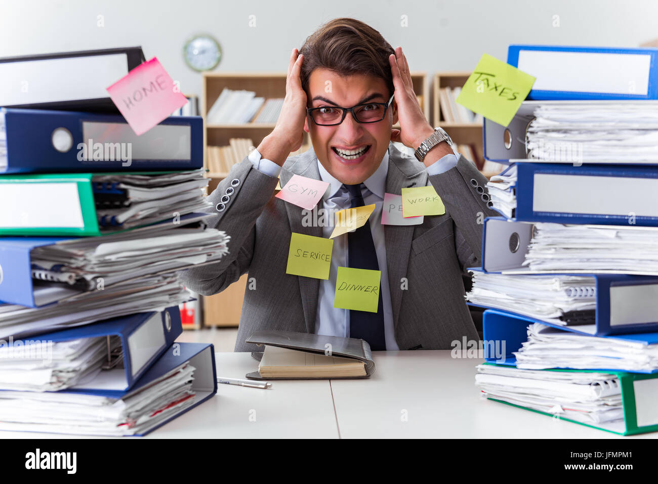Businessman struggling with multiple priorities Stock Photo - Alamy