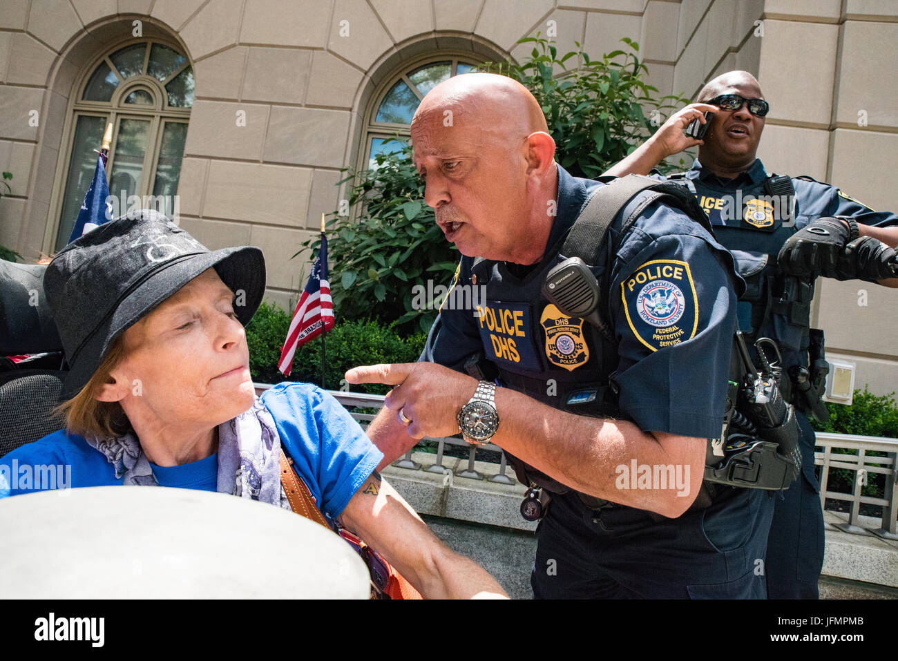 Woman confronts police officer hi-res stock photography and images - Alamy