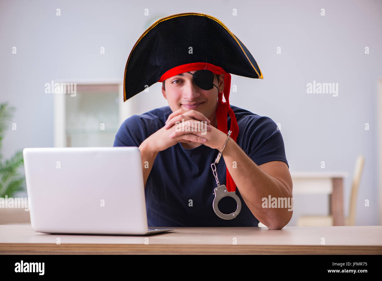 Digital security concept with pirate at computer Stock Photo - Alamy