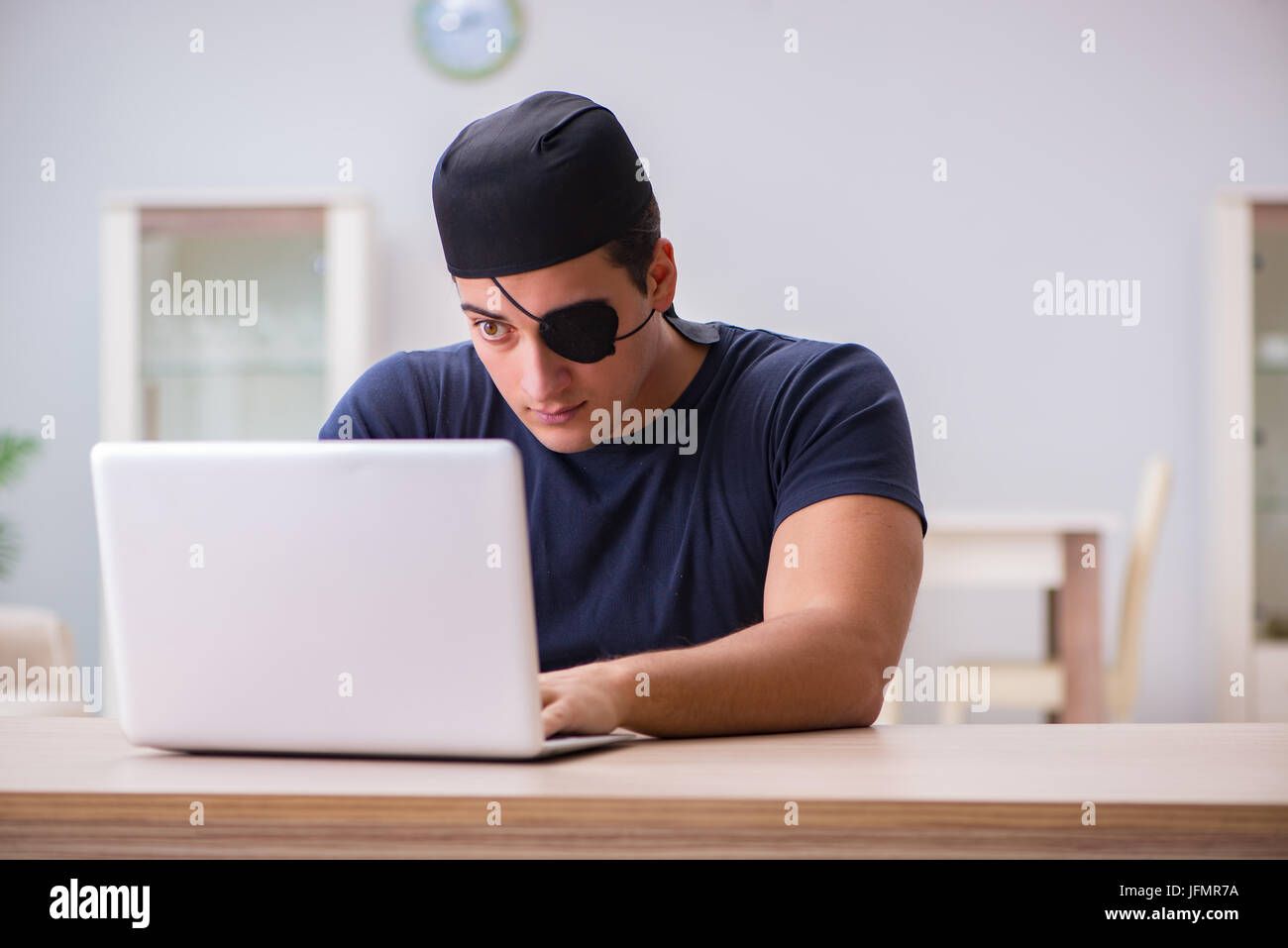 Digital security concept with pirate at computer Stock Photo - Alamy