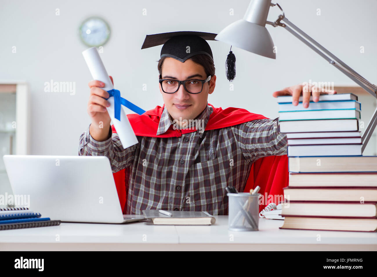 Super hero student with books studying for exams Stock Photo - Alamy