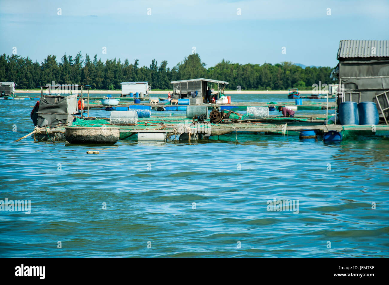 Marine fish farm in Vietnam. Floating houses Stock Photo - Alamy