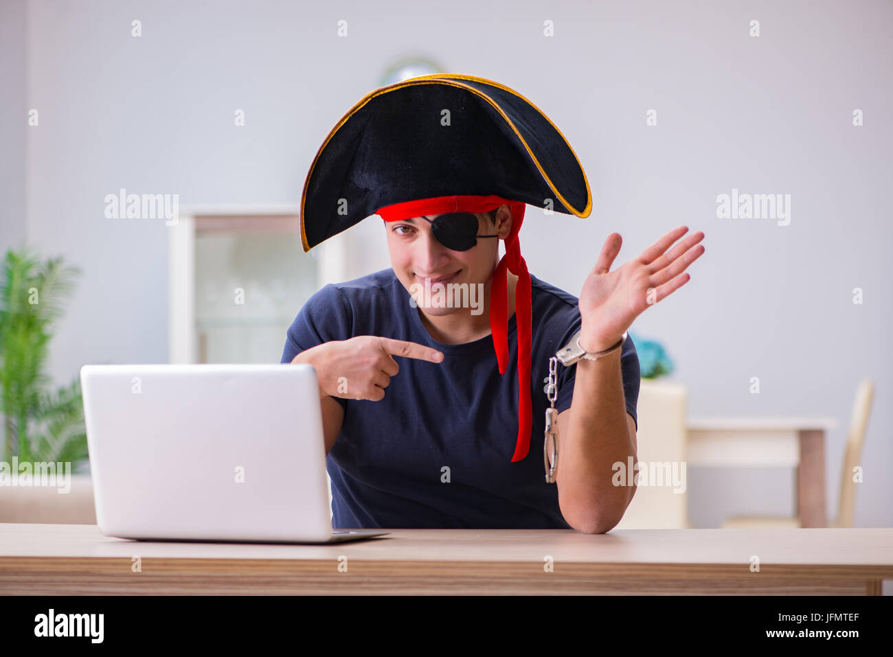 Digital security concept with pirate at computer Stock Photo - Alamy