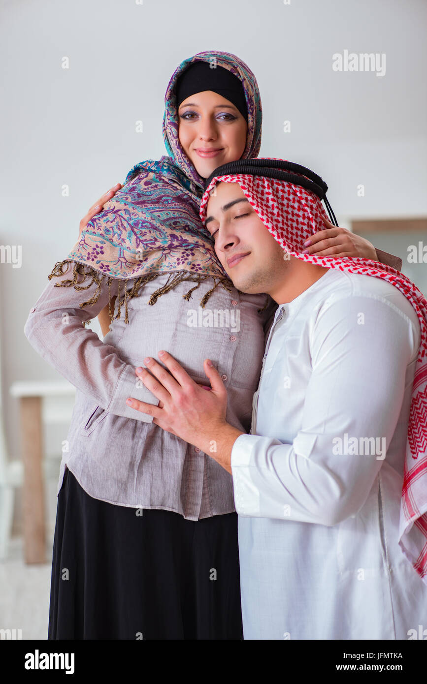 Young arab muslim family with pregnant wife expecting baby Stock Photo ...